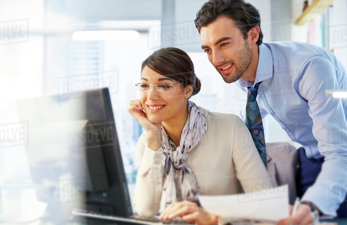Man and woman working together in office - Royalty-free Stock Photo ...