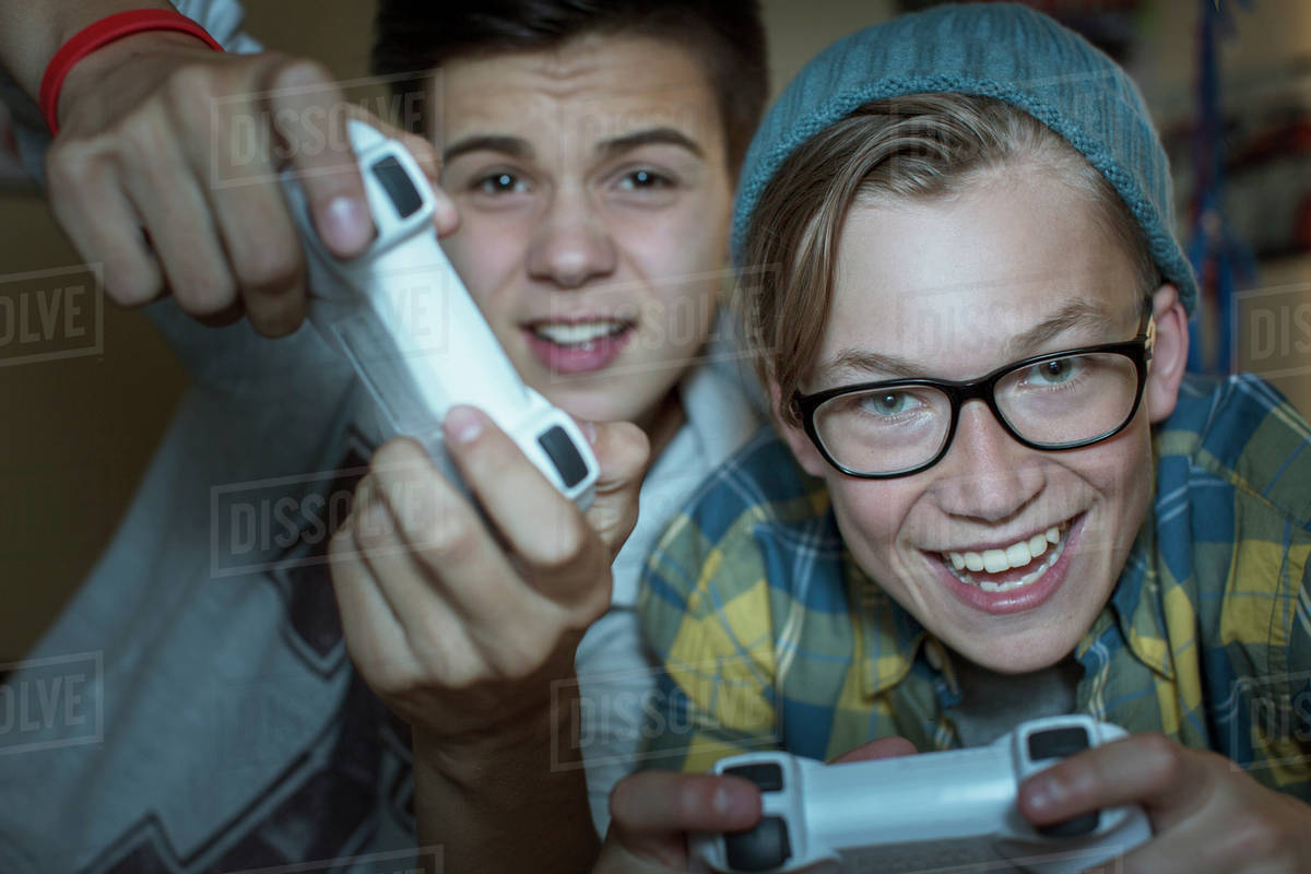 Two teenage boys playing together video game - Royalty-free Stock Photo ...