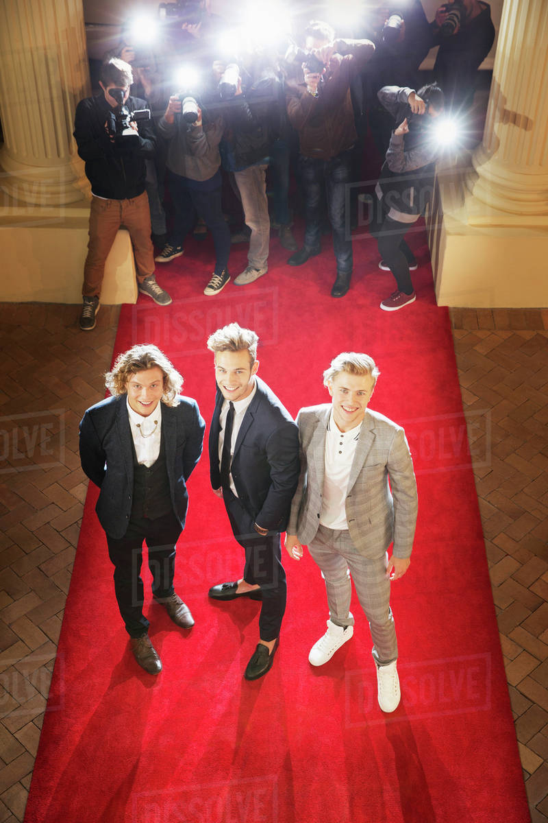 Portrait of smiling celebrities posing on red carpet - Royalty-free ...