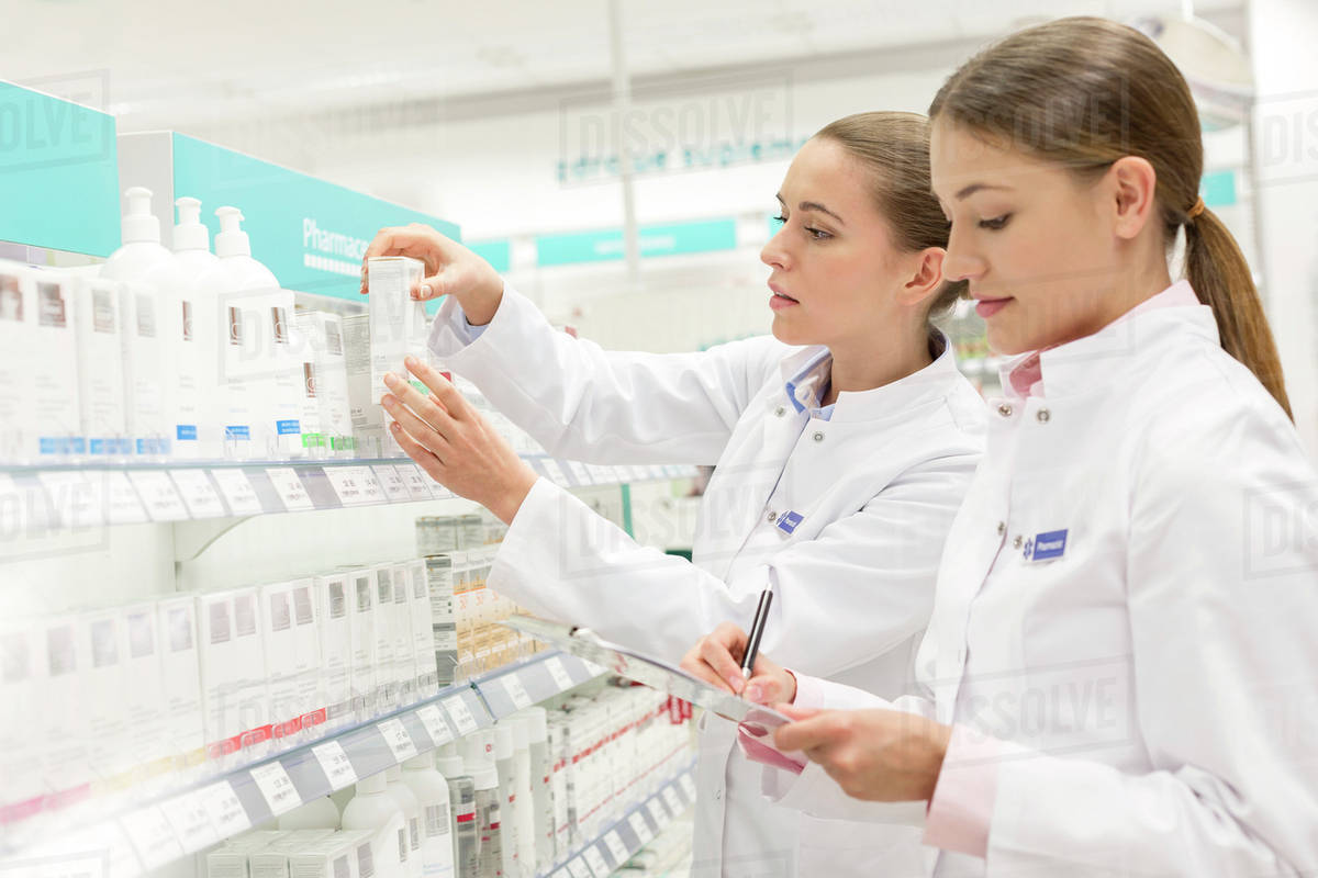 Pharmacists taking inventory in pharmacy - Royalty-free Stock Photo ...