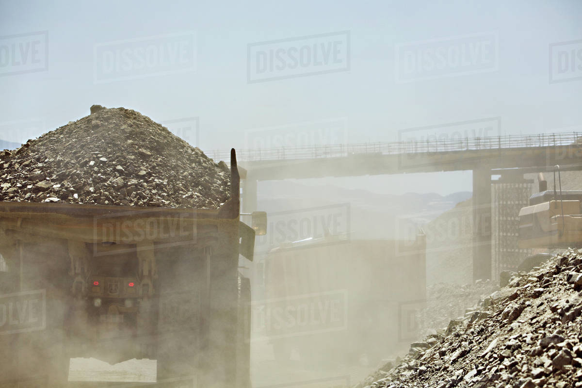Truck carting rubble in quarry - Stock Photo - Dissolve