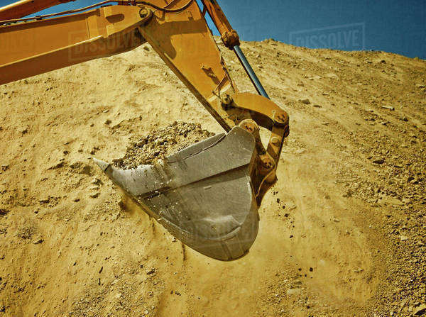 Digger working in quarry - Stock Photo - Dissolve