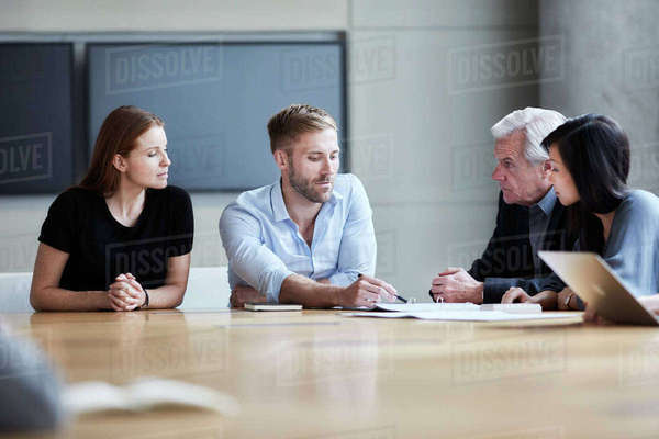 Business people discussing paperwork in meeting - Royalty-free Stock ...