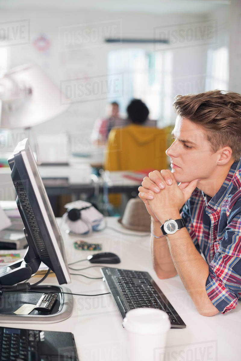 Businessman working at computer at desk - Royalty-free Stock Photo ...