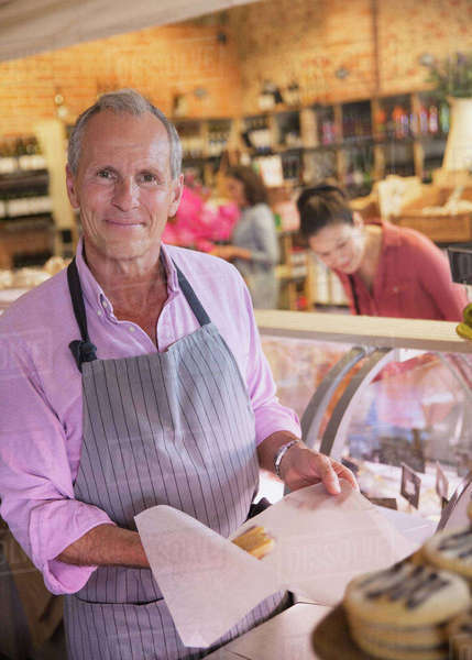 Portrait smiling deli worker in grocery store - Royalty-free Stock ...