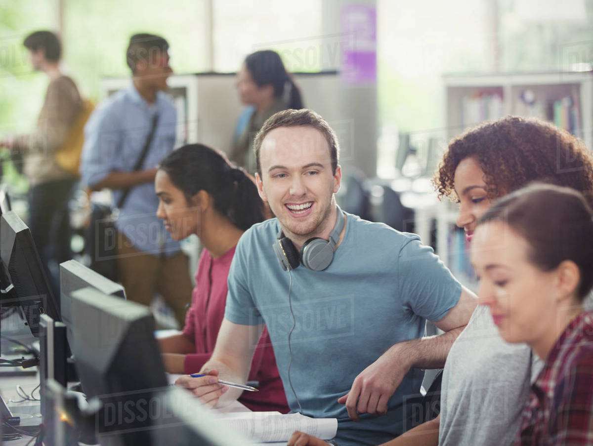 College students using computers in computer lab library - Royalty-free ...
