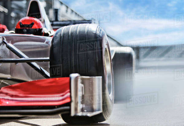 Race car sitting on track - Royalty-free Stock Photo | Dissolve