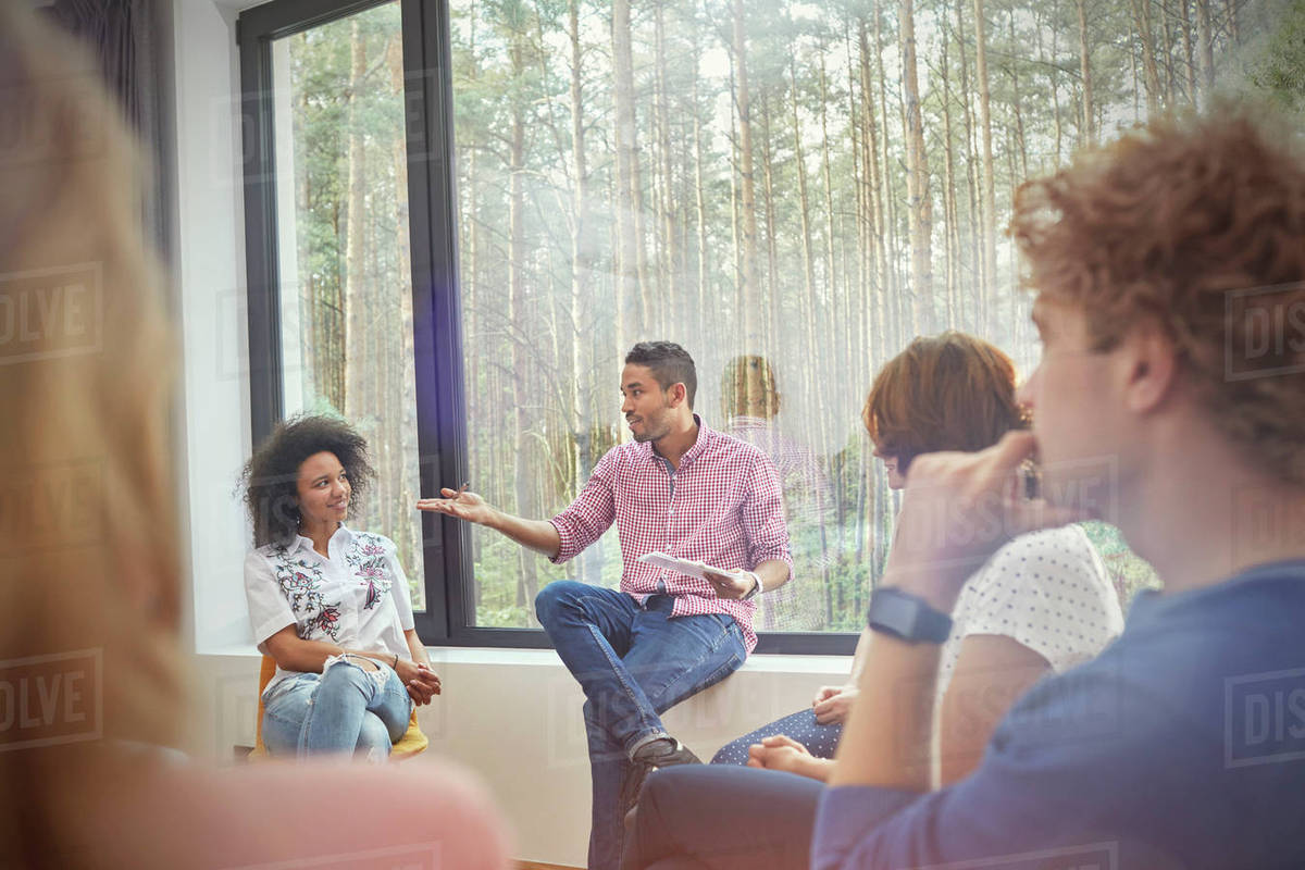 Man talking in group therapy session - Royalty-free Stock Photo | Dissolve