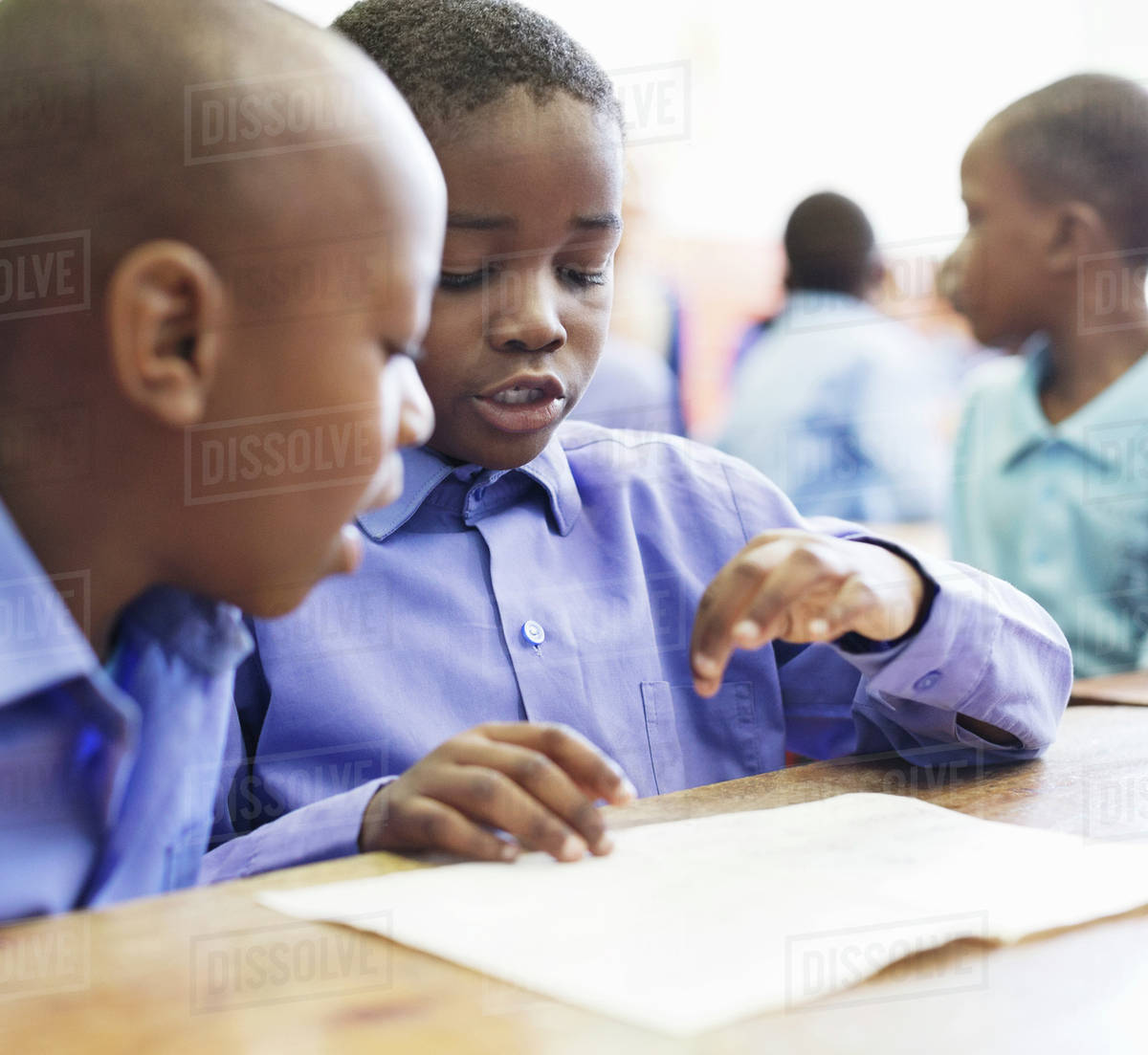 Students talking in class - Stock Photo - Dissolve