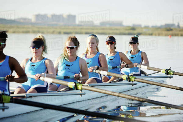 Female rowers rowing scull on sunny lake - Royalty-free Stock Photo ...