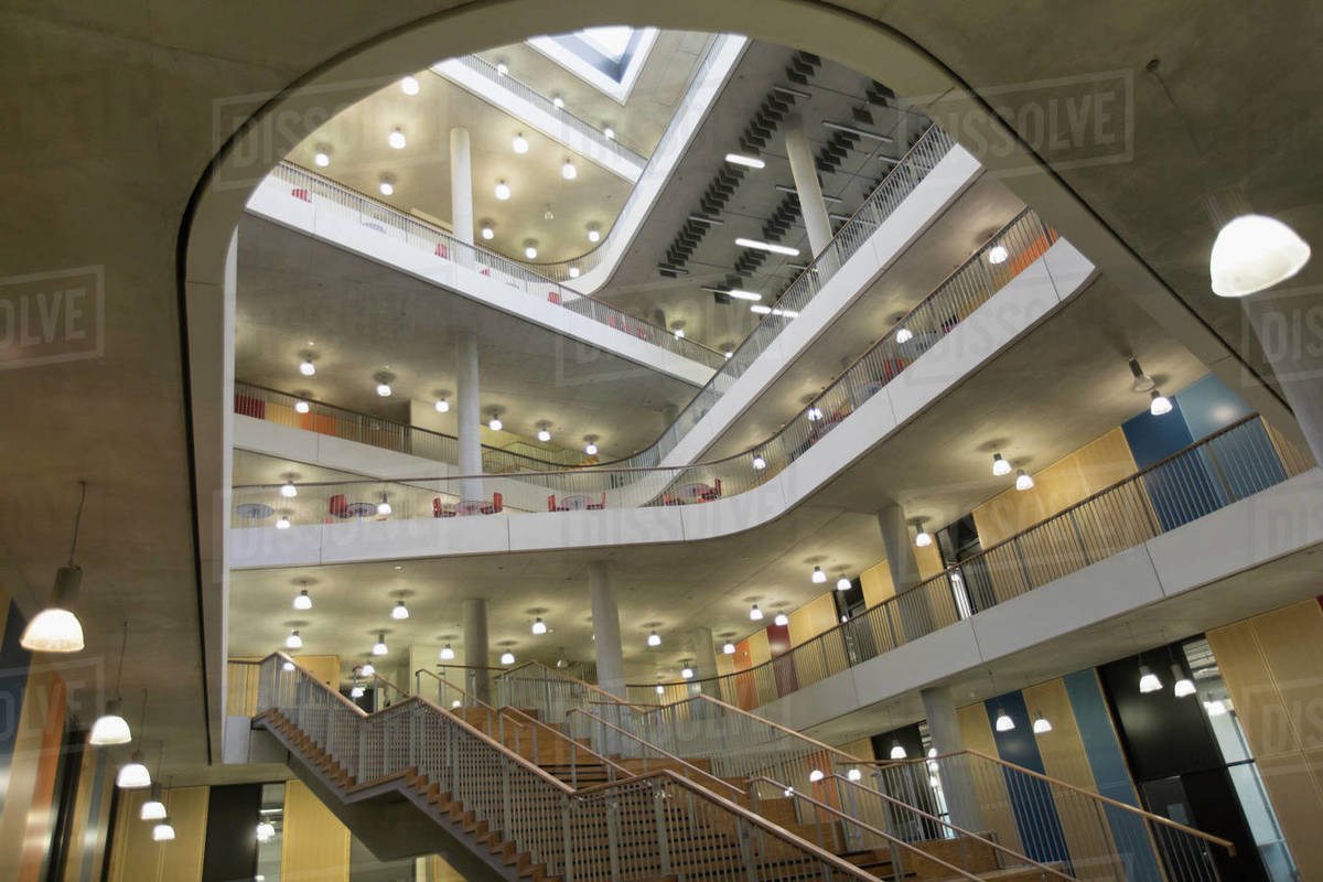 Modern office lobby atrium with balconies - Stock Photo - Dissolve
