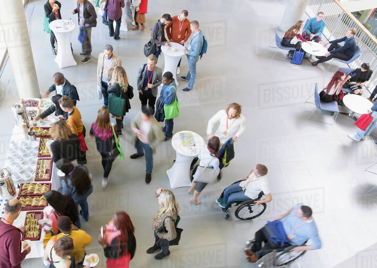 Business people networking, enjoying coffee break at conference ...