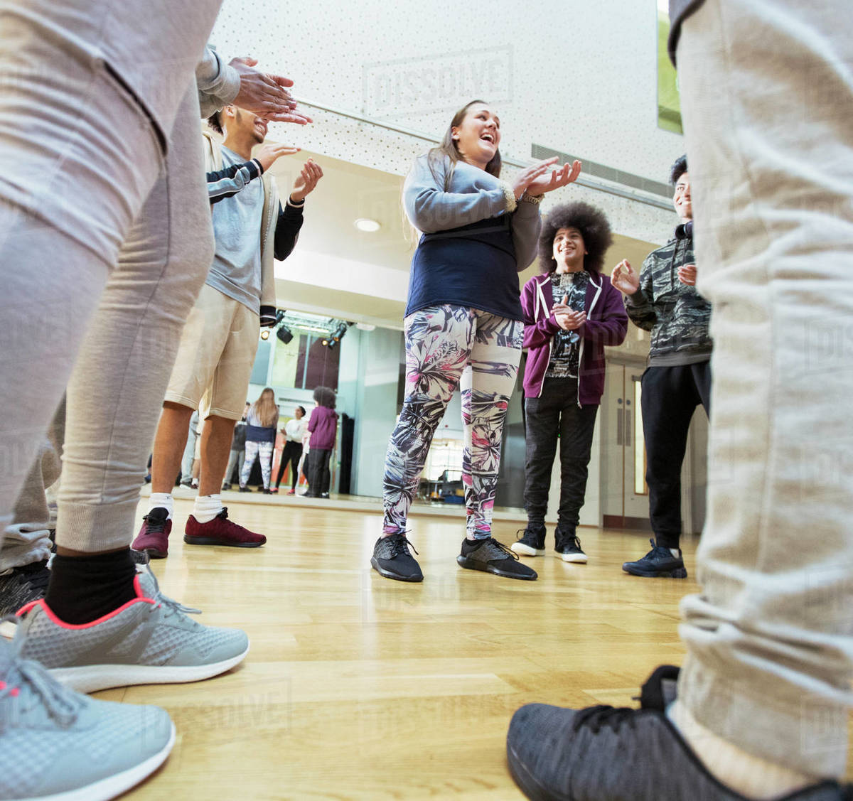 Teenage classmates clapping in dance class studio - Royalty-free Stock ...