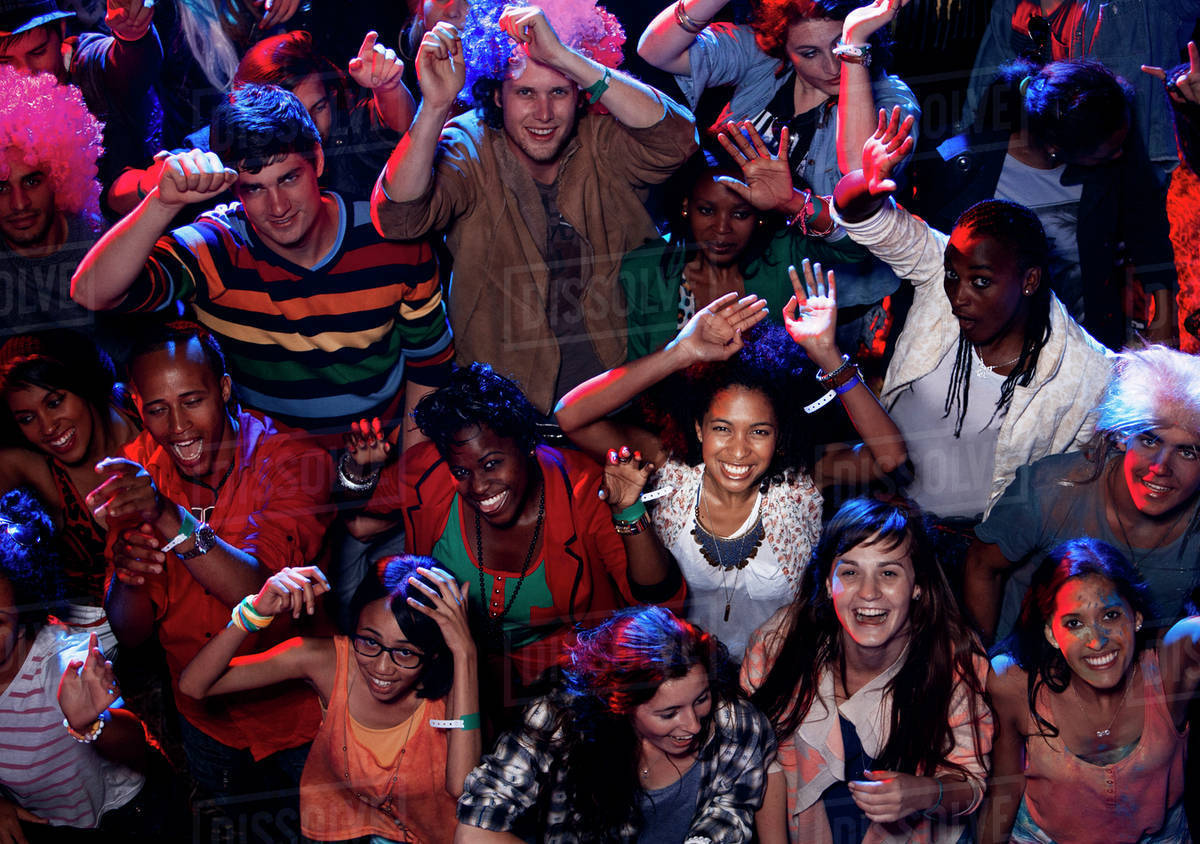 Fans cheering at music festival - Stock Photo - Dissolve