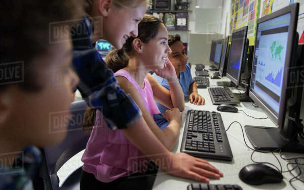 Junior high school students using computer in classroom - Royalty-free ...