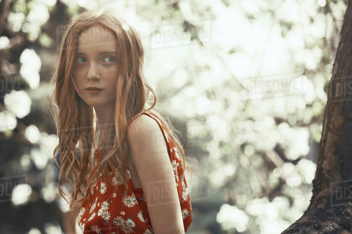 Beautiful tween girl in park - Stock Photo - Dissolve