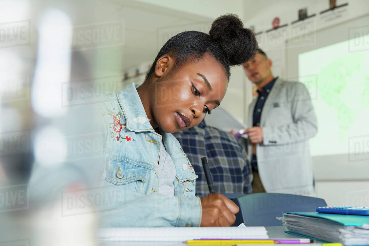 Focused high school girl student studying in classroom - Stock Photo ...