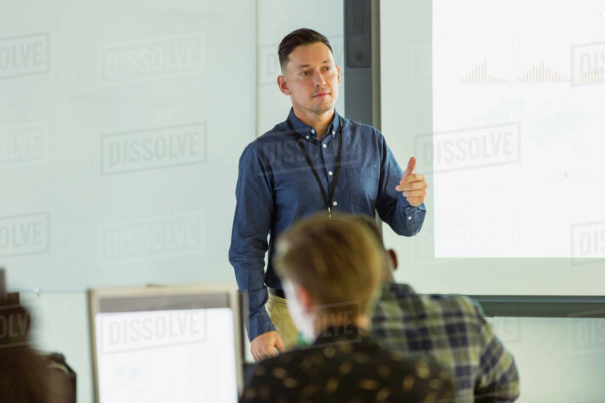 High school teacher talking, leading lesson in classroom - Royalty-free ...