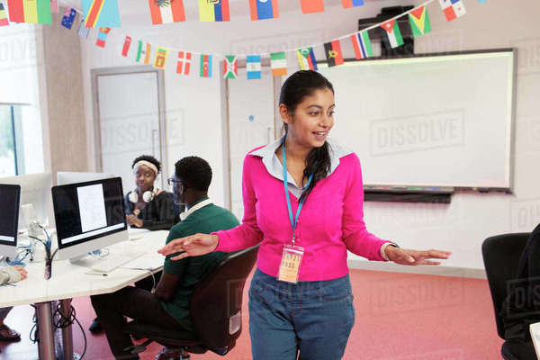 Community college instructor leading lesson in computer lab classroom ...