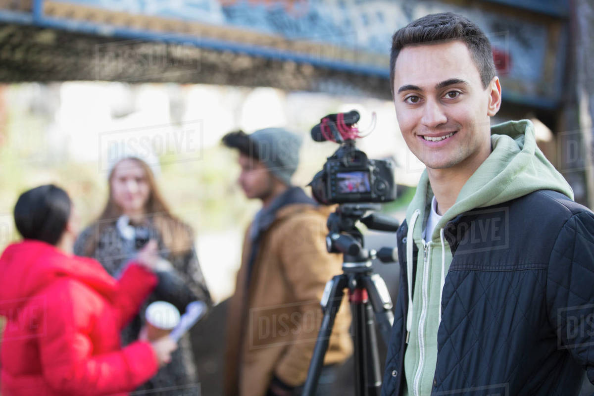 Portrait confident young man vlogging with friends - Royalty-free Stock ...