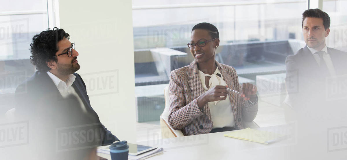 Business people talking in conference room meeting - Stock Photo - Dissolve