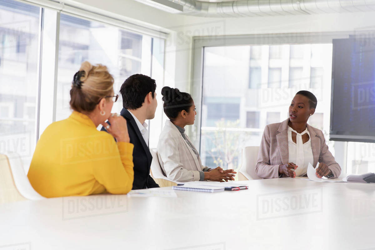 Business people talking in conference room meeting - Stock Photo - Dissolve