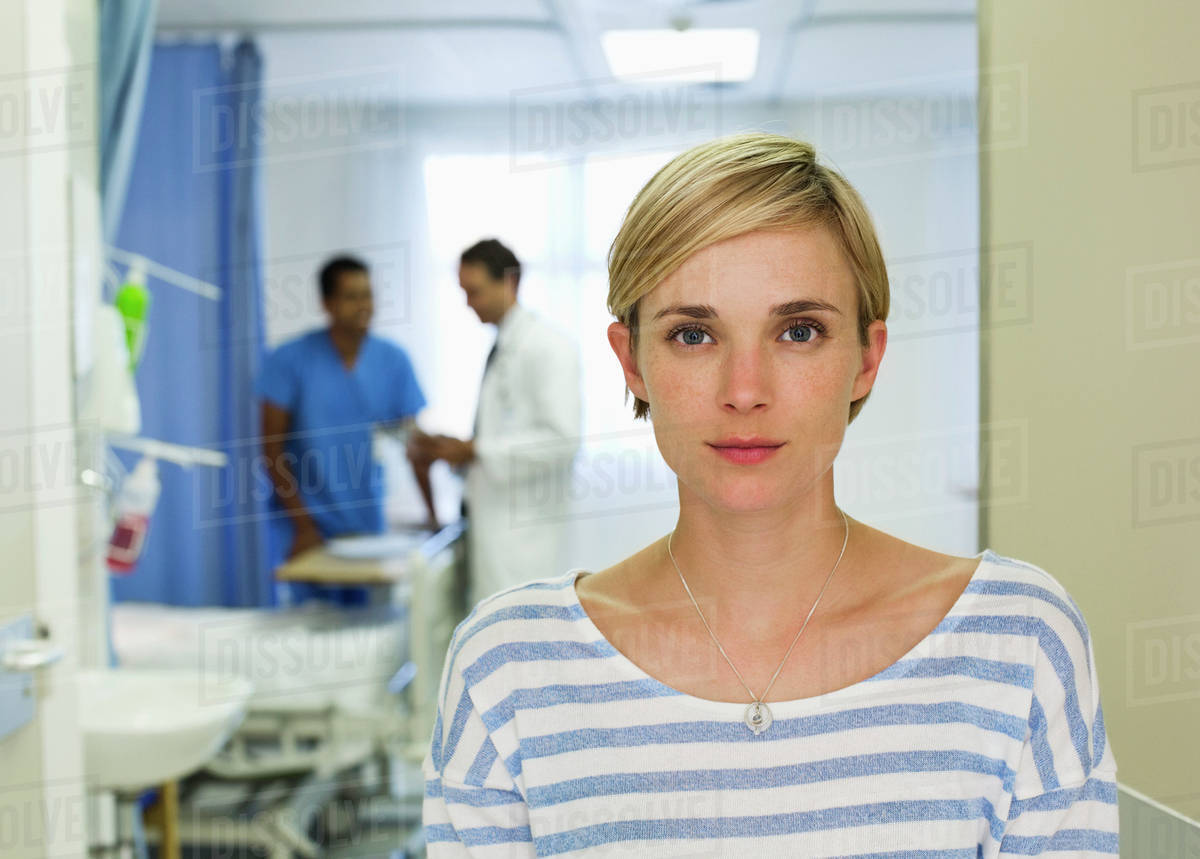 Patient standing in hospital room - Royalty-free Stock Photo | Dissolve