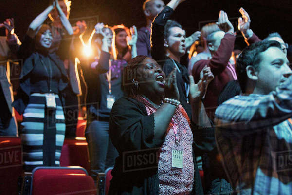 Audience clapping and cheering in dark concert hall - Royalty-free ...