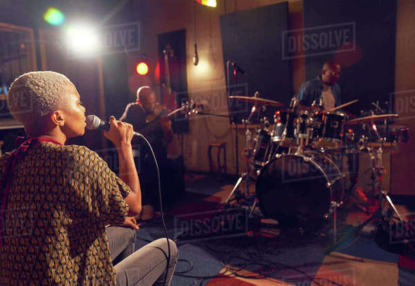 Musicians performing in recording studio - Royalty-free Stock Photo ...