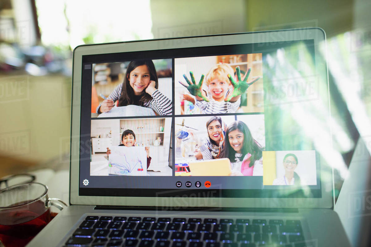 Students and teacher e-learning on laptop screen - Stock Photo - Dissolve