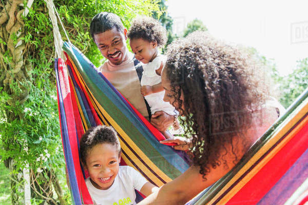 Portrait happy family at sunny summer hammock - Royalty-free Stock ...