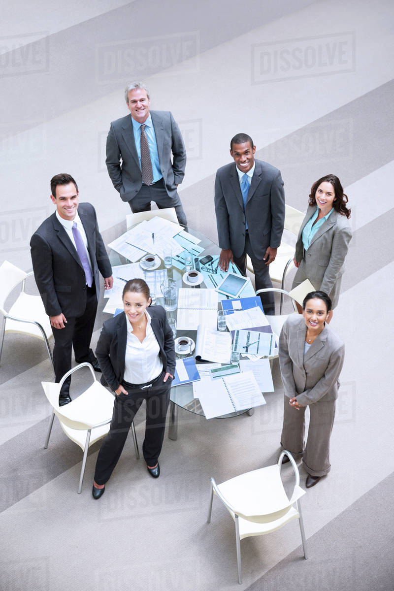 High angle portrait of smiling business people at table - Royalty-free ...