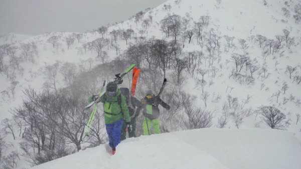 Slow motion of skiers trudging through snow - HD Royalty-free Stock ...