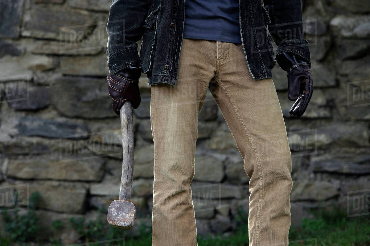 Man holding axe - Royalty-free Stock Photo | Dissolve