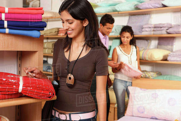 Three people shopping in household store - Royalty-free Stock Photo ...