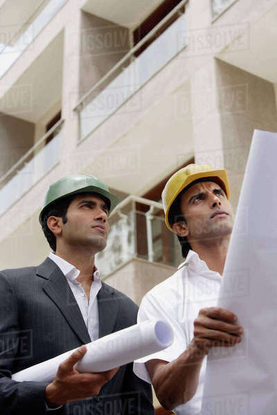 Contractors or architects with blueprints - Royalty-free Stock Photo ...