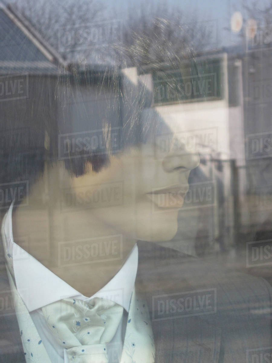 Detail of a male mannequin in a store window - Stock Photo - Dissolve