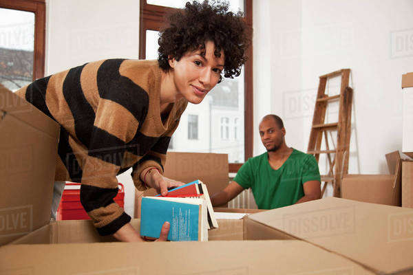 A couple packing moving boxes - Stock Photo - Dissolve