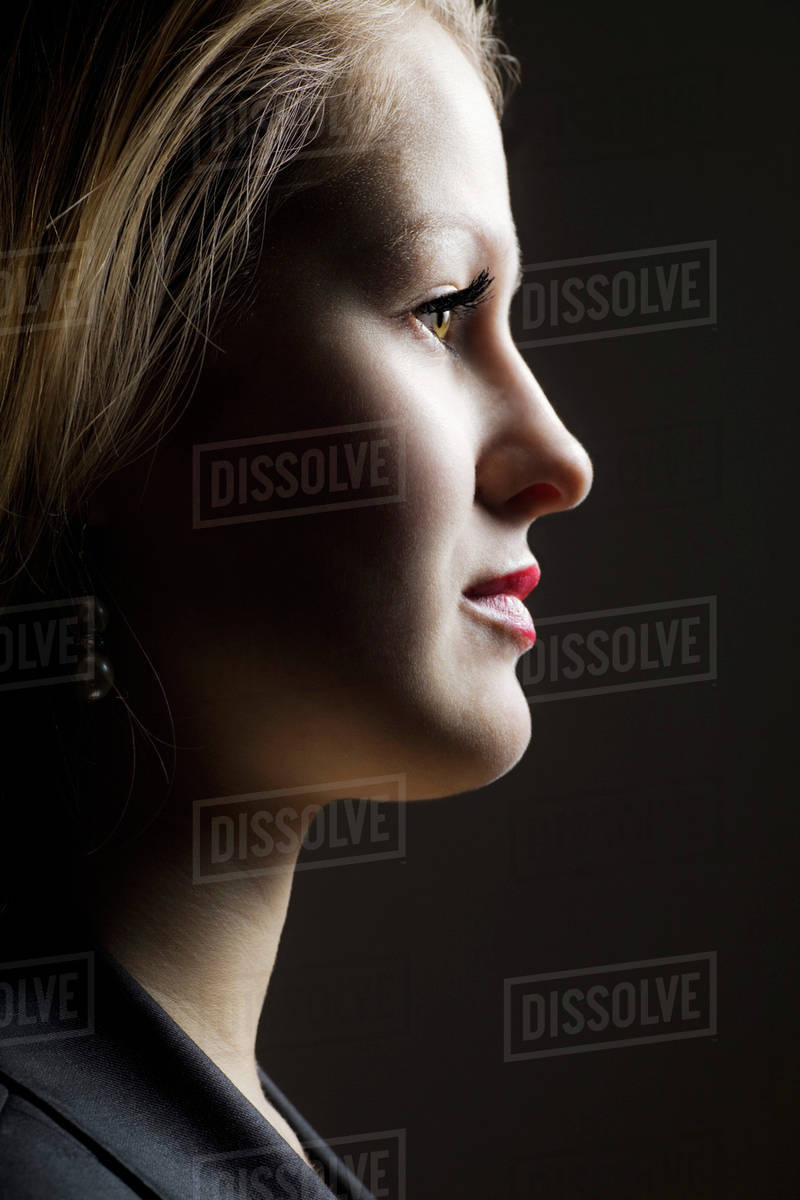 Shadowed profile of young woman - Royalty-free Stock Photo | Dissolve