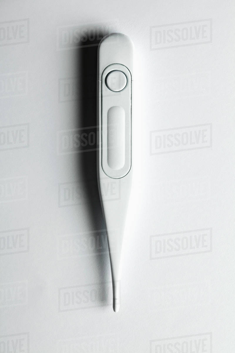 A digital thermometer painted white - Stock Photo - Dissolve