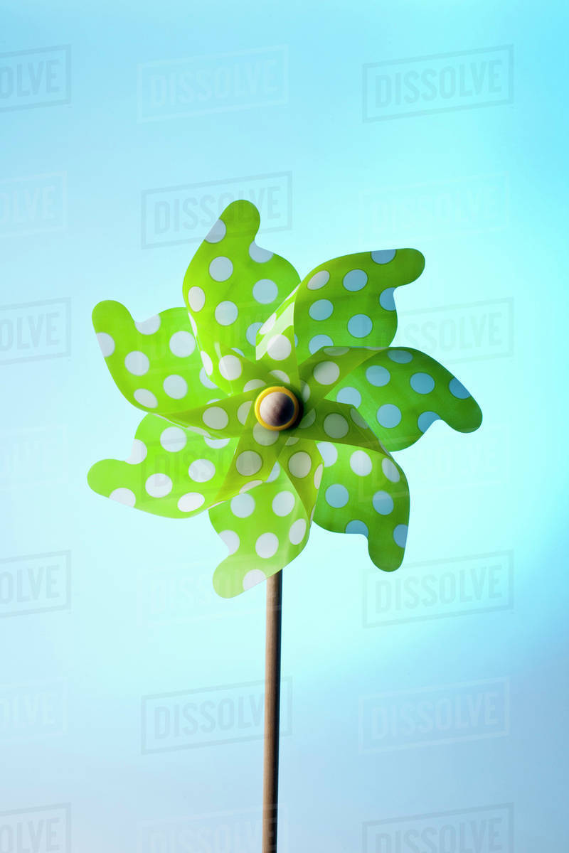 A green pinwheel with polka dots - Royalty-free Stock Photo | Dissolve