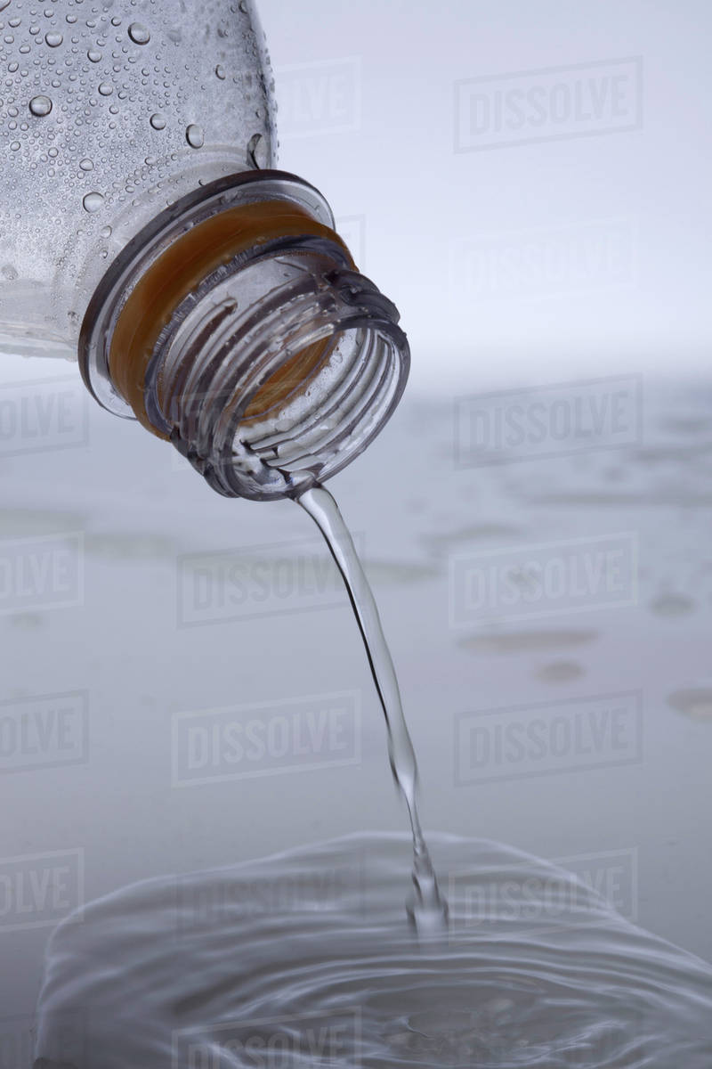 Water pouring out of a plastic water bottle, close-up - Royalty-free ...