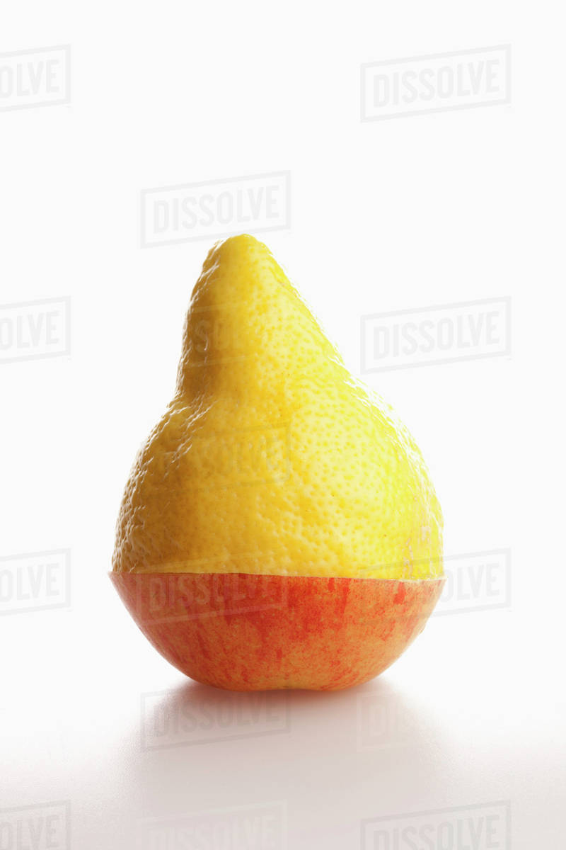 Two pieces of different fruit stacked to comprise the shape of a piece ...