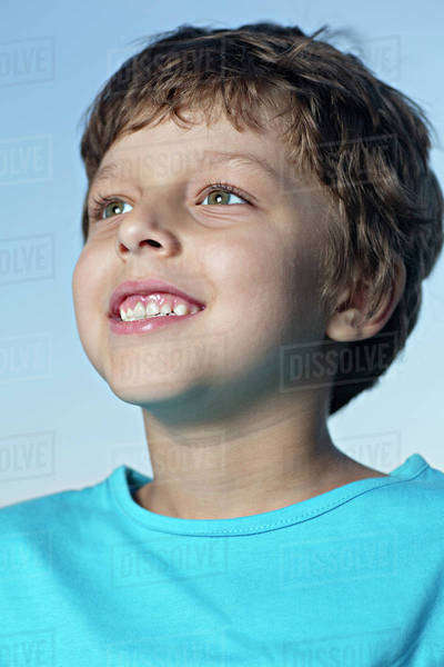A boy looking off camera with excitement - Royalty-free Stock Photo ...