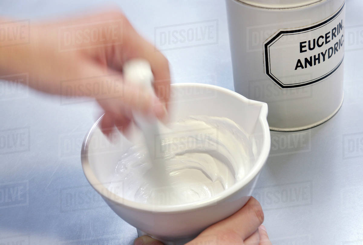 Pharmacist mixing skin cream - Royalty-free Stock Photo | Dissolve