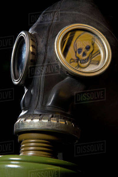 A gas mask with a skull and crossbones warning sign inside the mask ...