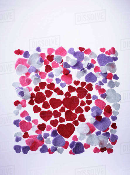 Various velvet hearts over colored background - Royalty-free Stock ...