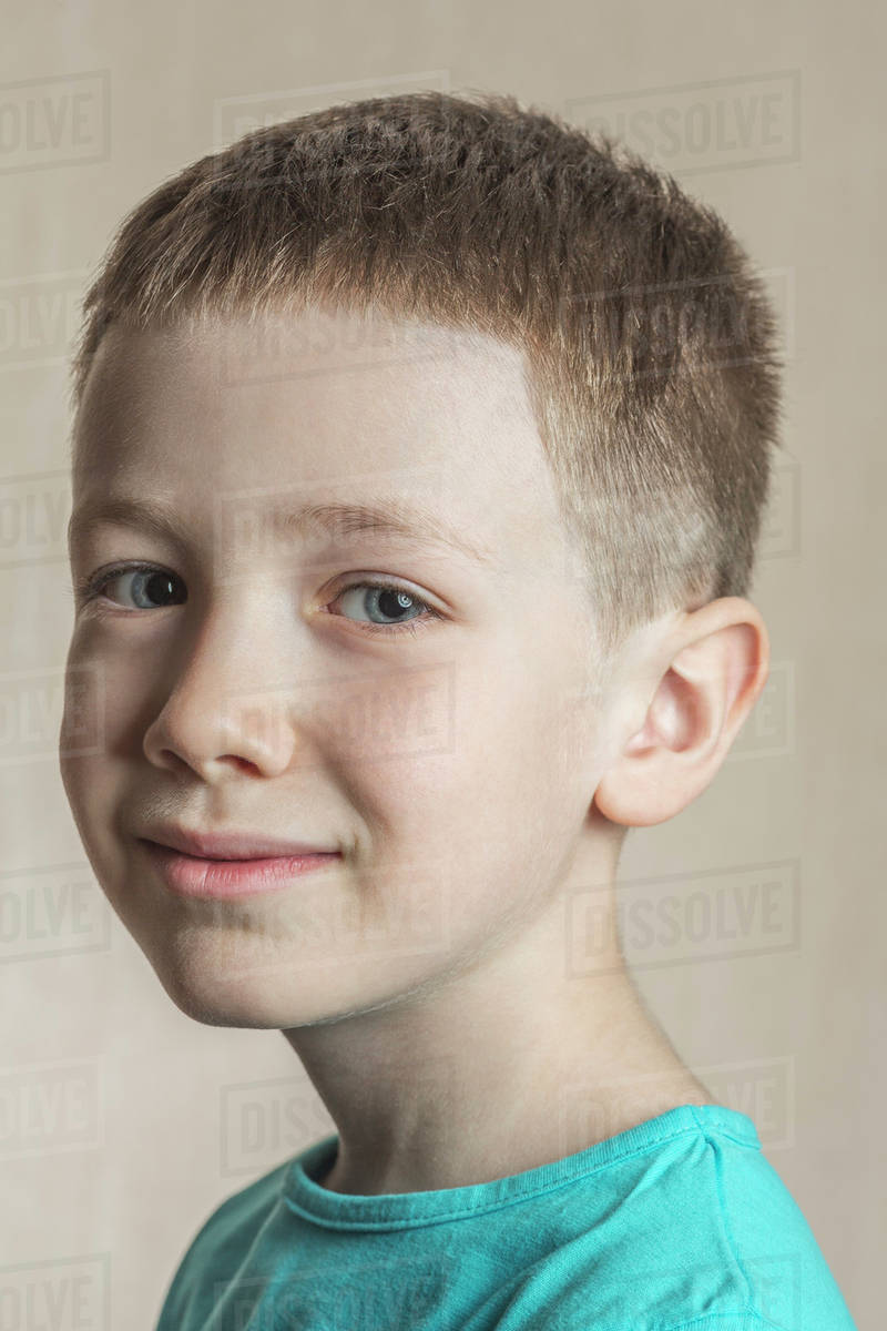 Close-up portrait of cute boy over colored background - Royalty-free ...