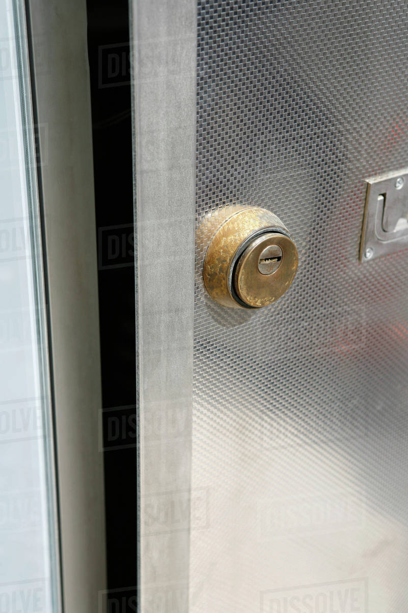 Lock on a door, close-up - Royalty-free Stock Photo | Dissolve