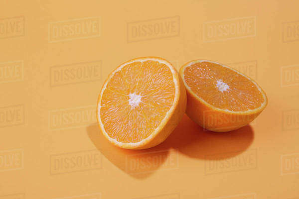 Two halves of an orange - Royalty-free Stock Photo | Dissolve